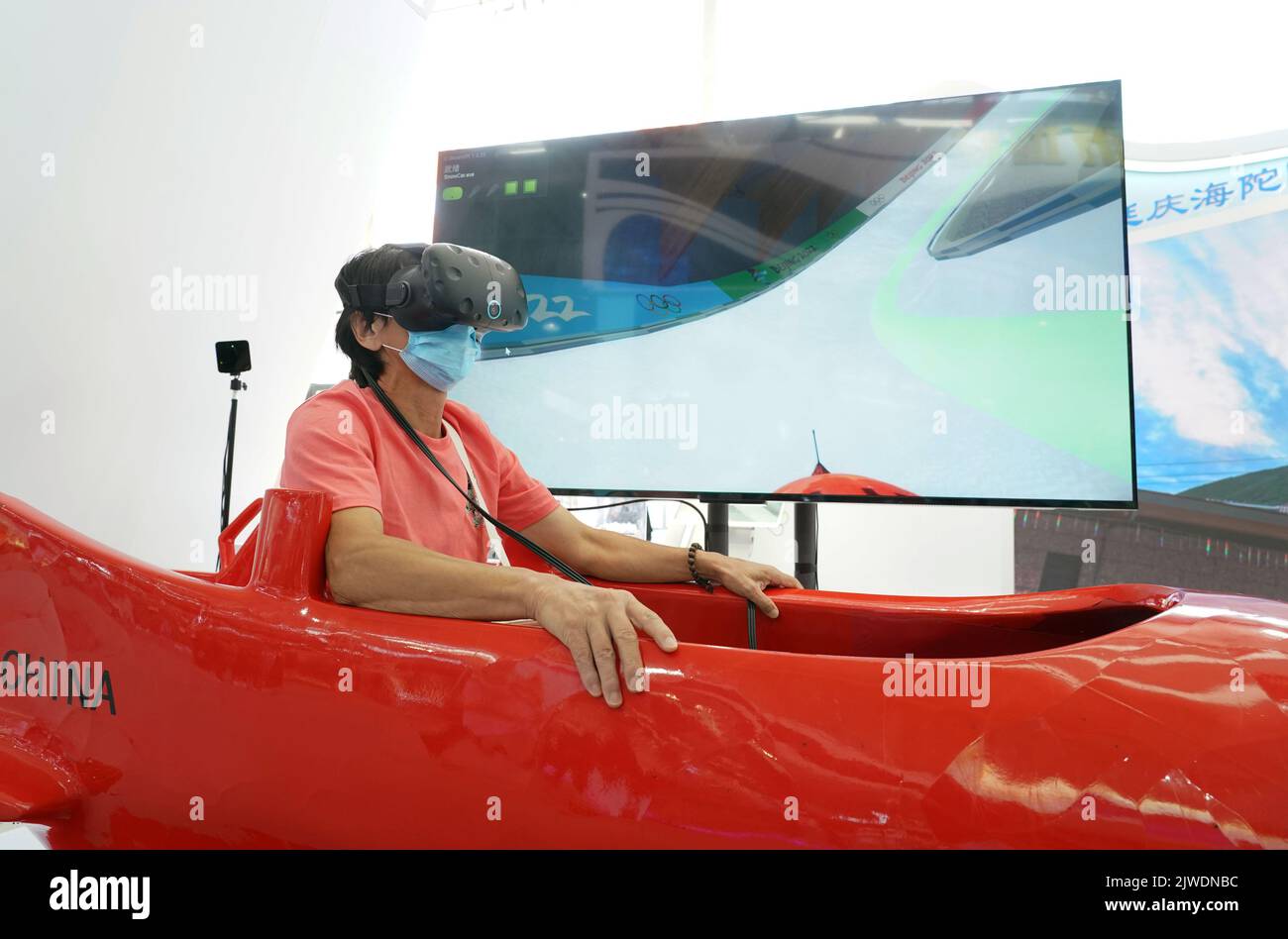 Beijing, China. 5th Sep, 2022. A visitor rides a VR-powered bobsleigh at the cultural and ...