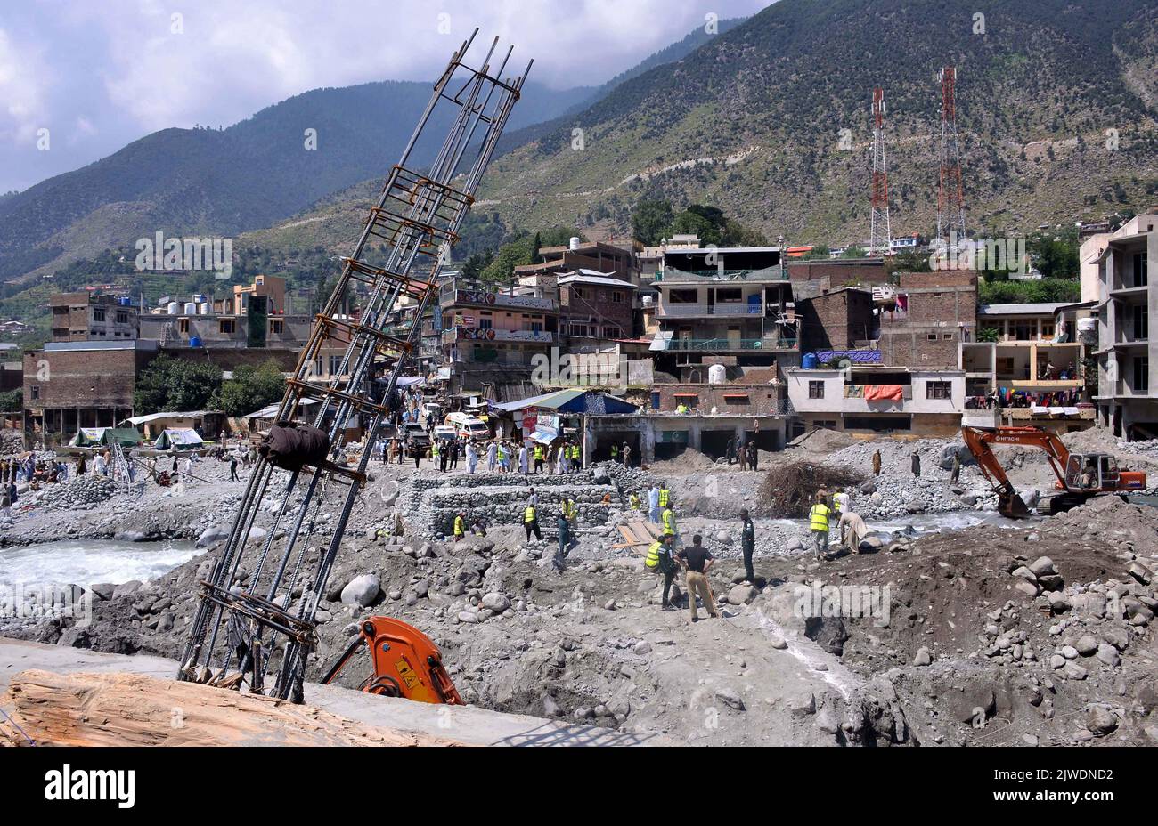 Swat. 5th Sep, 2022. Local authorities work at a damaged area after ...
