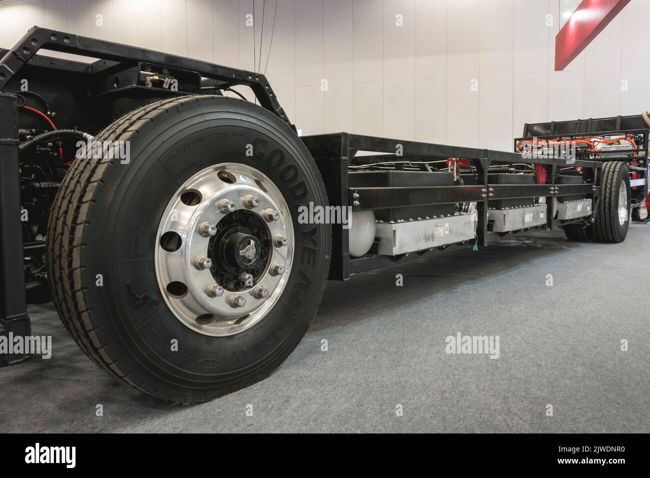 Exposed chassis, engine and gears of a electric bus on display at the ...
