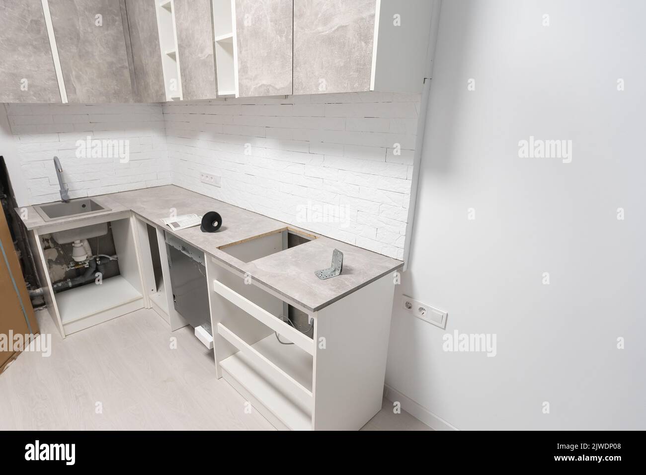 Modern kitchen with empty Built-in dishwasher, Stainless steel ...