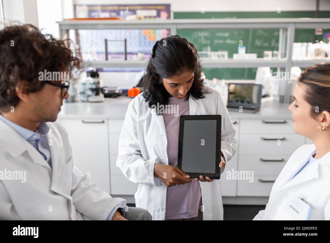 scientists with tablet pc working in laboratory Stock Photo - Alamy