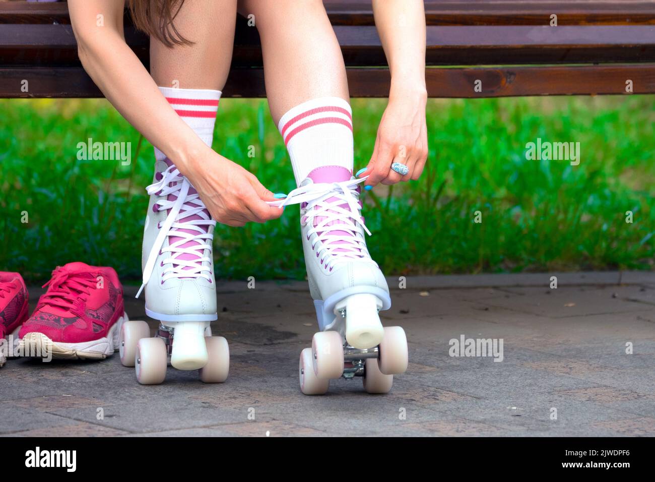 Woman in roller skates sitting hi-res stock photography and images - Alamy