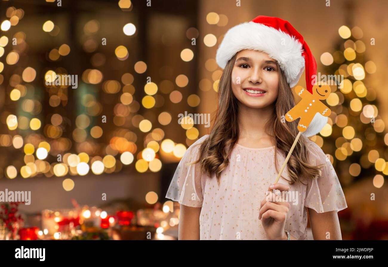 happy teenage girl in santa hat on christmas Stock Photo - Alamy
