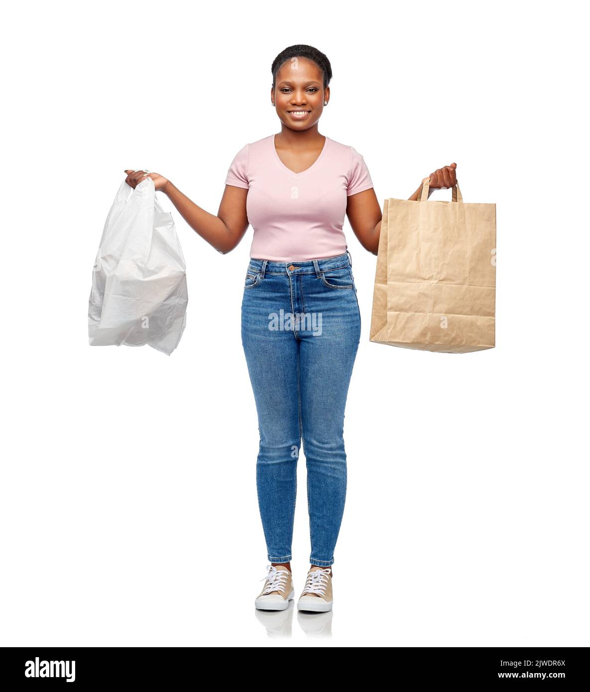 african woman comparing paper and plastic bags Stock Photo - Alamy