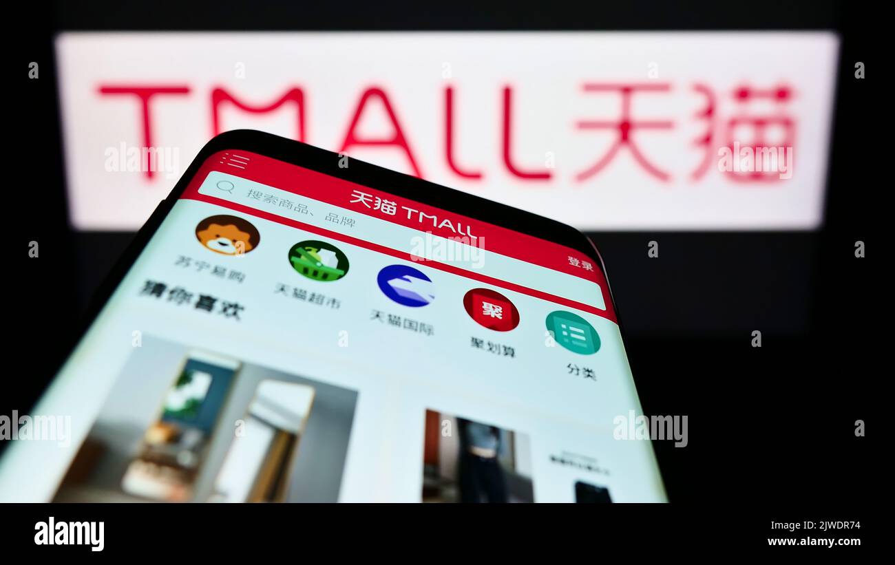 Mobile phone with webpage of Chinese e-commerce company Tmall.com ...