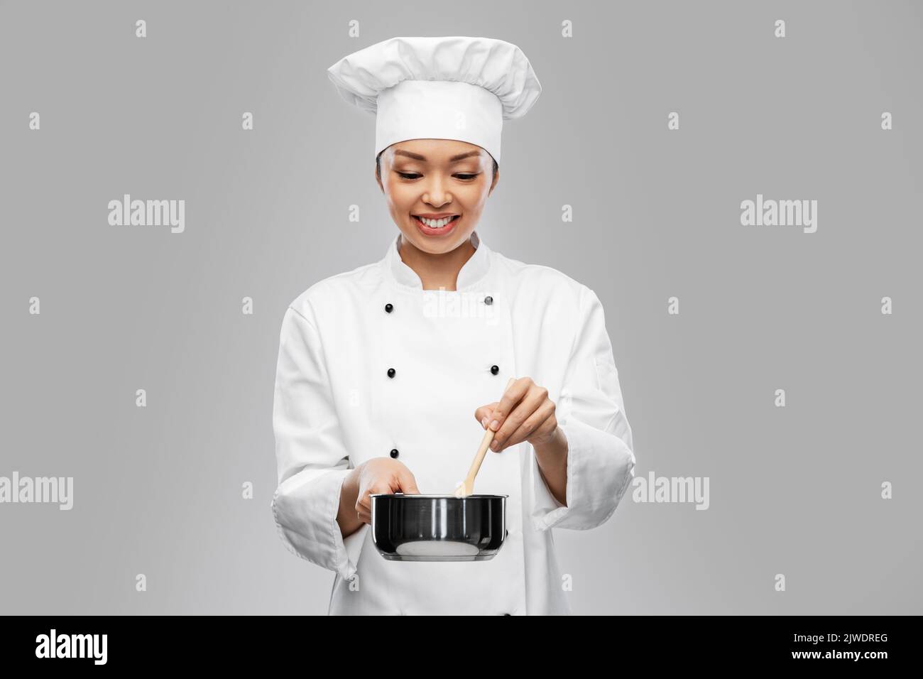 happy smiling female chef with saucepan Stock Photo - Alamy