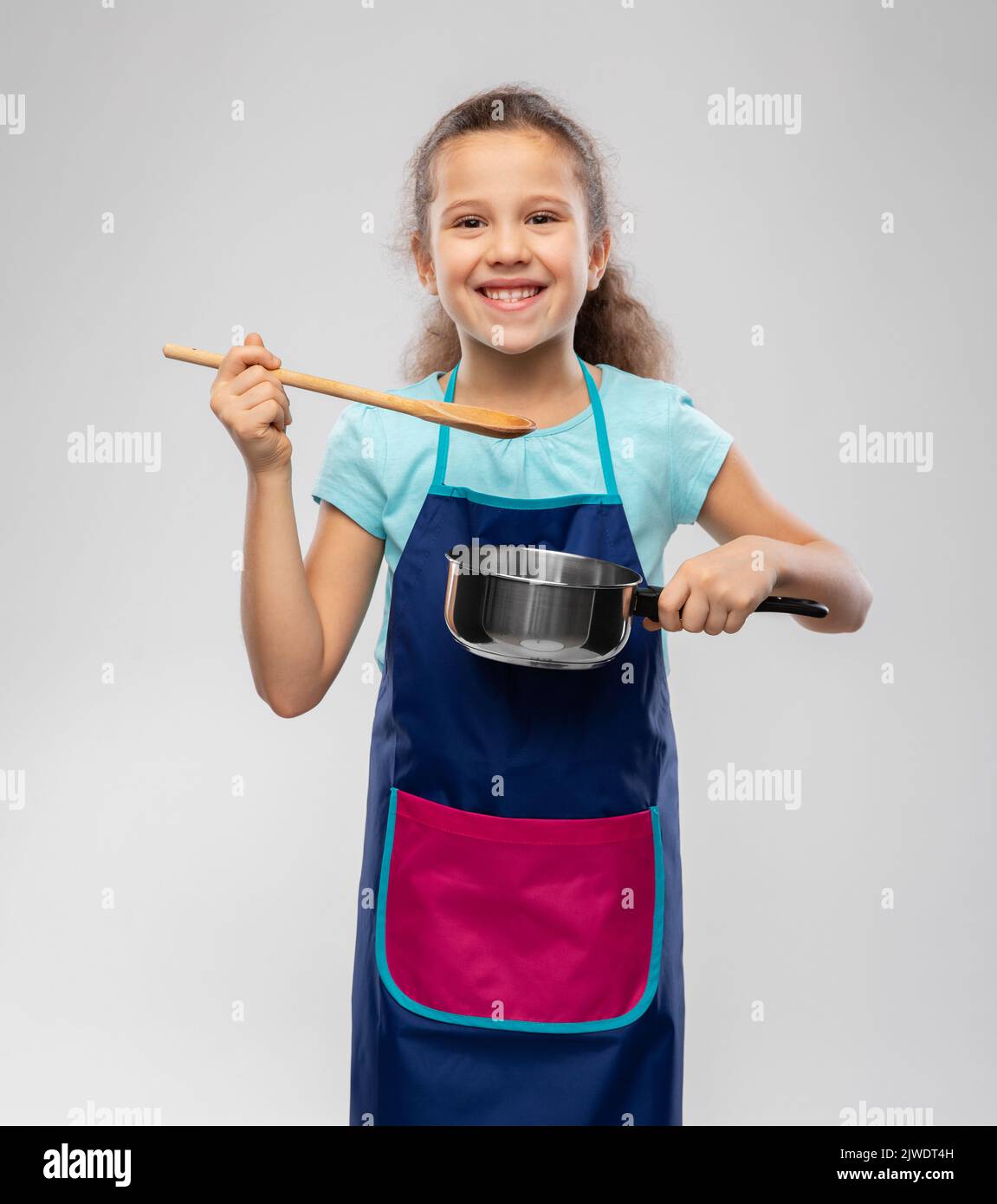 Teen girl tasting food hi-res stock photography and images - Alamy