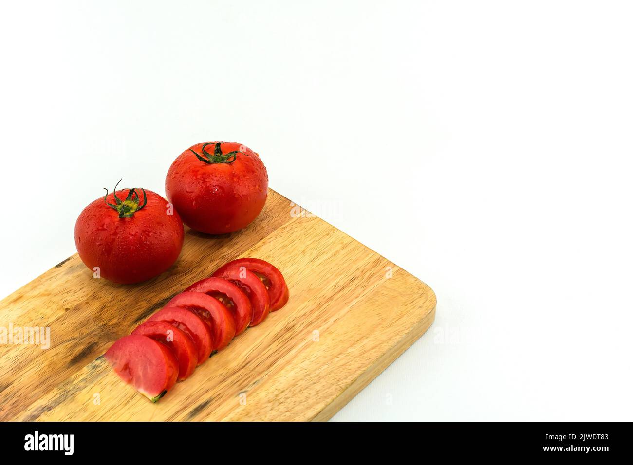 Tomato slides on the wooden floor Stock Photo - Alamy