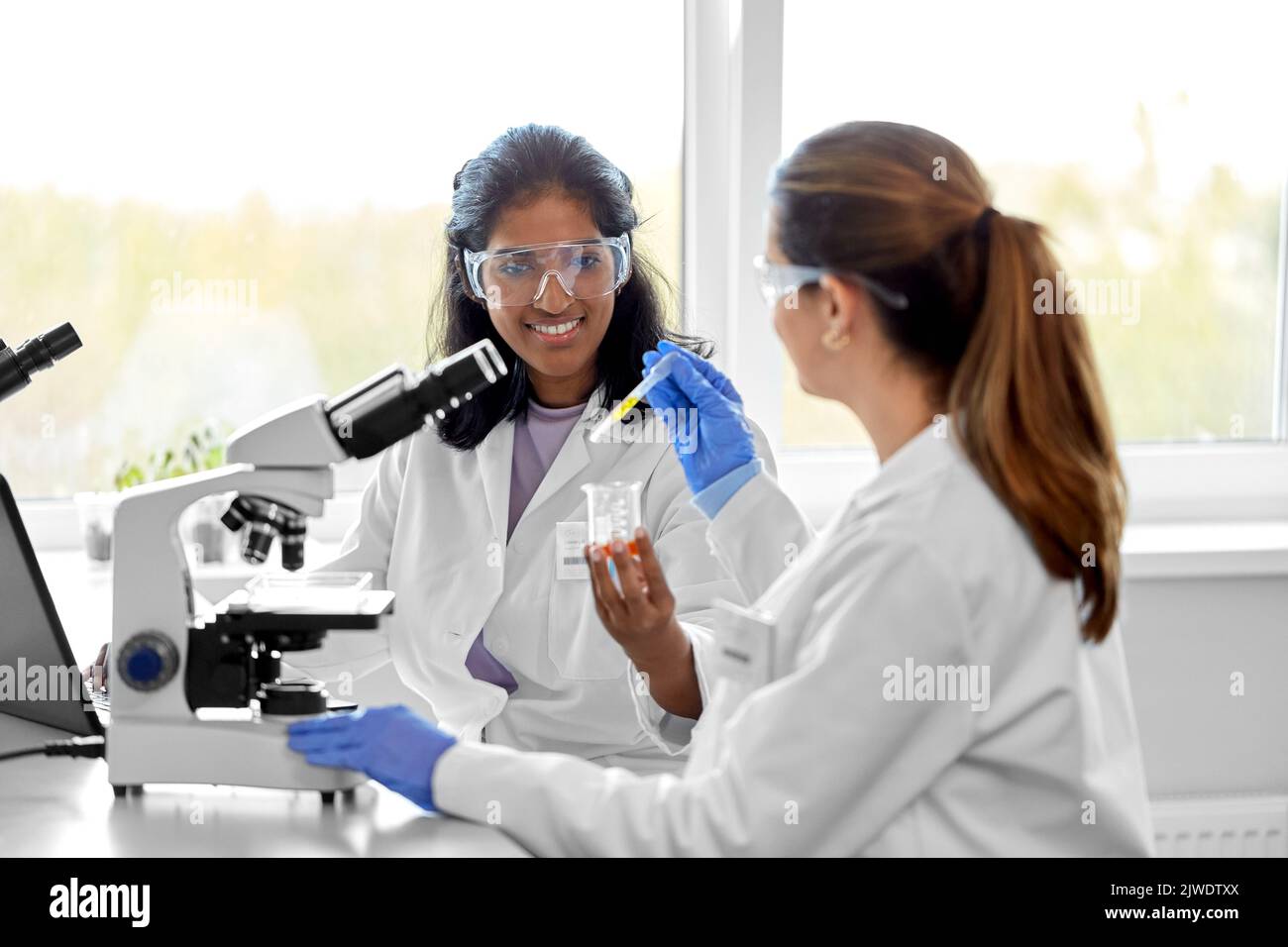 Scientists working microscope test hi-res stock photography and images ...