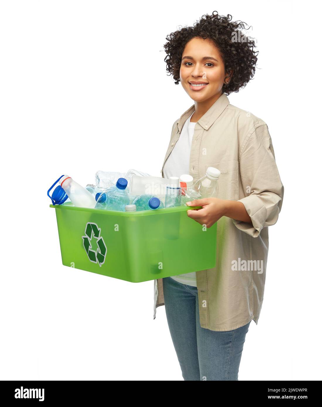 smiling young woman sorting plastic waste Stock Photo - Alamy