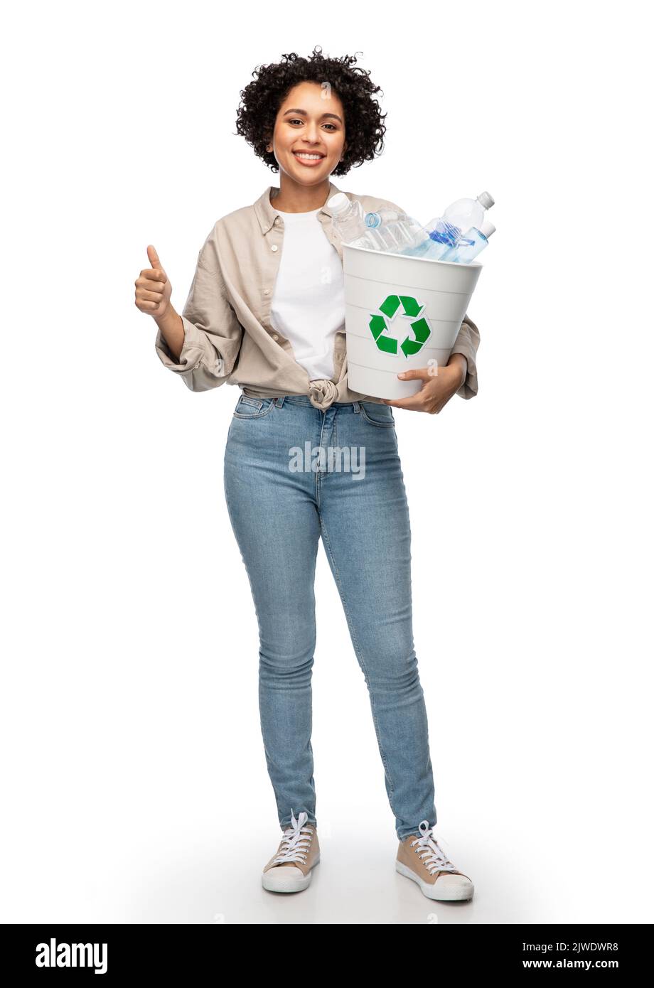 smiling young woman sorting plastic waste Stock Photo - Alamy