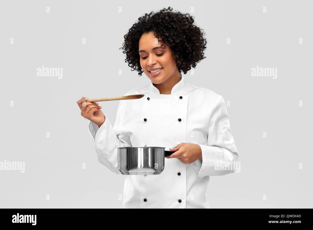 happy smiling female chef with saucepan Stock Photo - Alamy