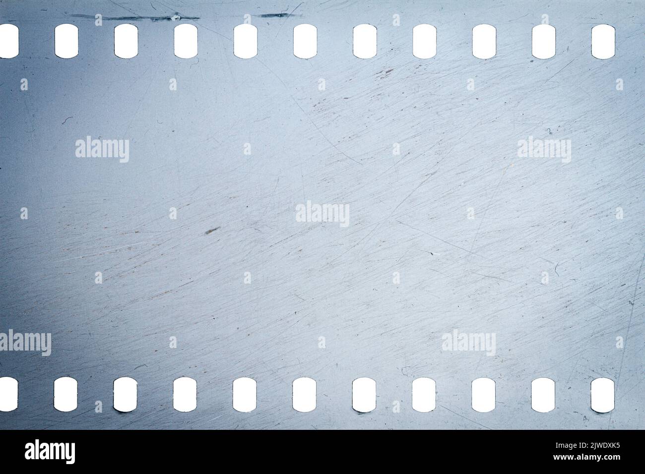 Dusty and grungy 35mm film texture or surface. Perforated scratched ...