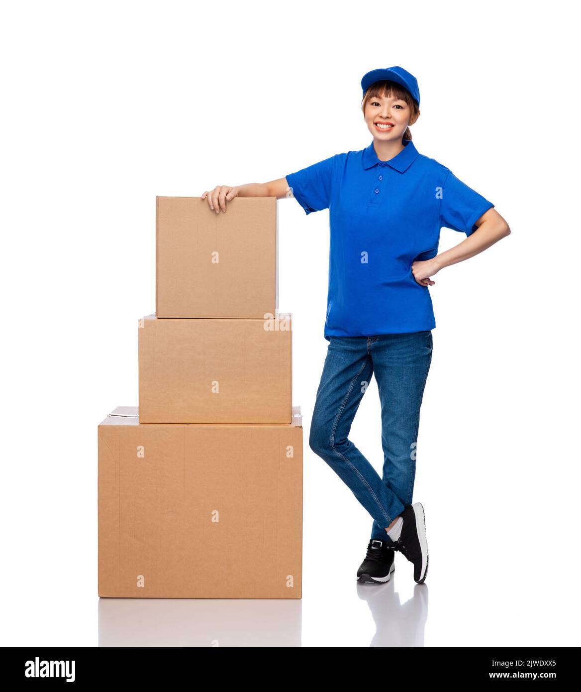 delivery woman in blue uniform with parcel boxes Stock Photo - Alamy