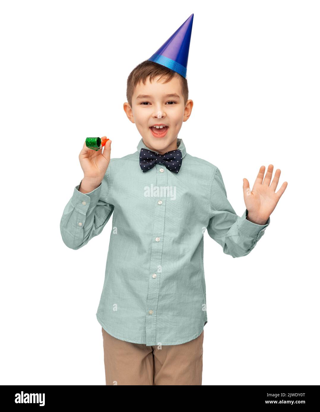 smiling boy in birthday party hat with blower Stock Photo - Alamy
