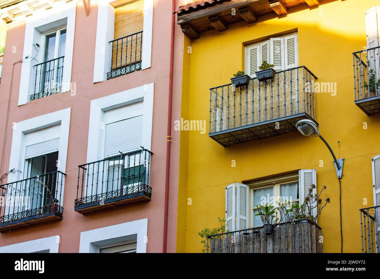 Yellow pink facades of residential apartment buildings houses in ...