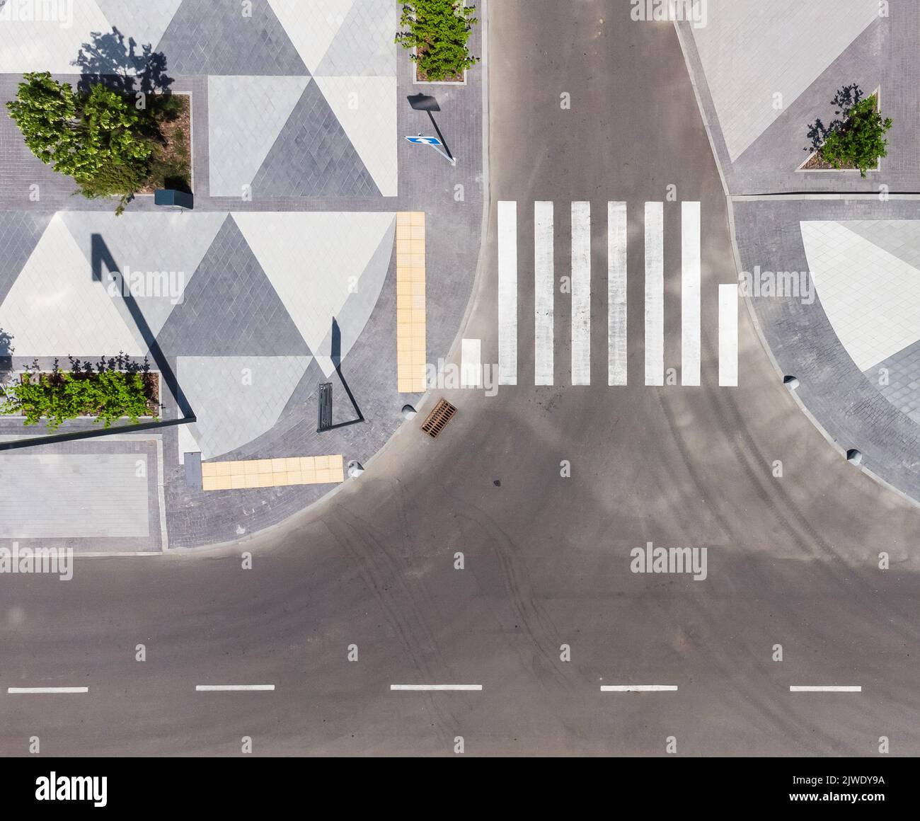 aerial top view of street with parking lot near new residential housing ...
