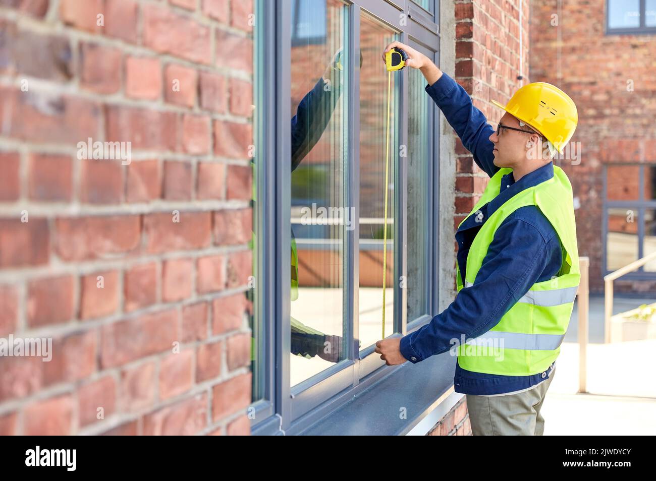 male builder with ruler measuring window Stock Photo - Alamy male builder with ruler measuring window Stock Photo - Alamy