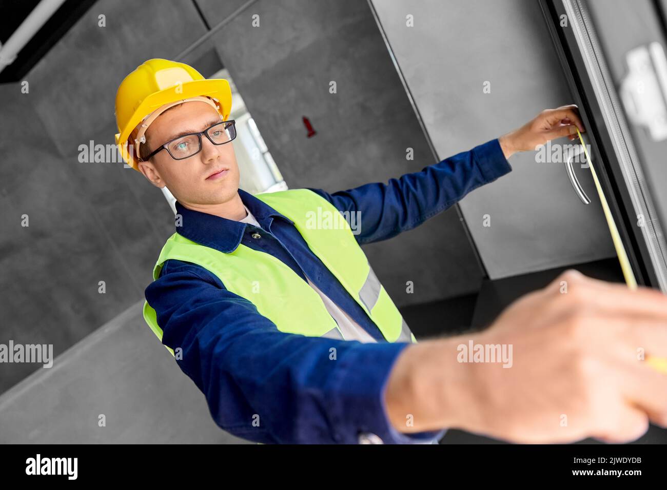 male builder with ruler measuring window Stock Photo - Alamy male builder with ruler measuring window Stock Photo - Alamy