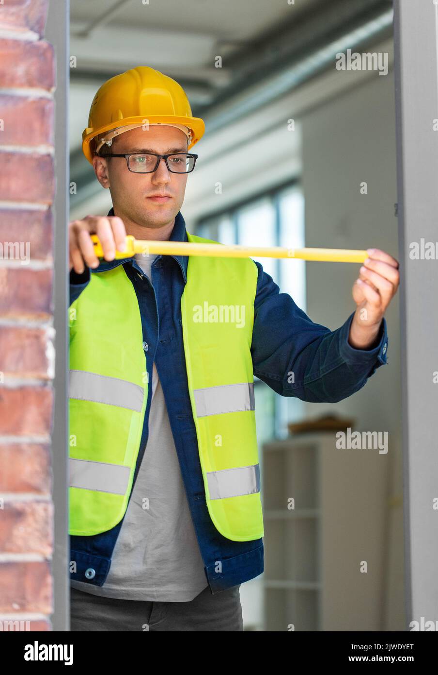 male builder with ruler measuring window Stock Photo - Alamy male builder with ruler measuring window Stock Photo - Alamy