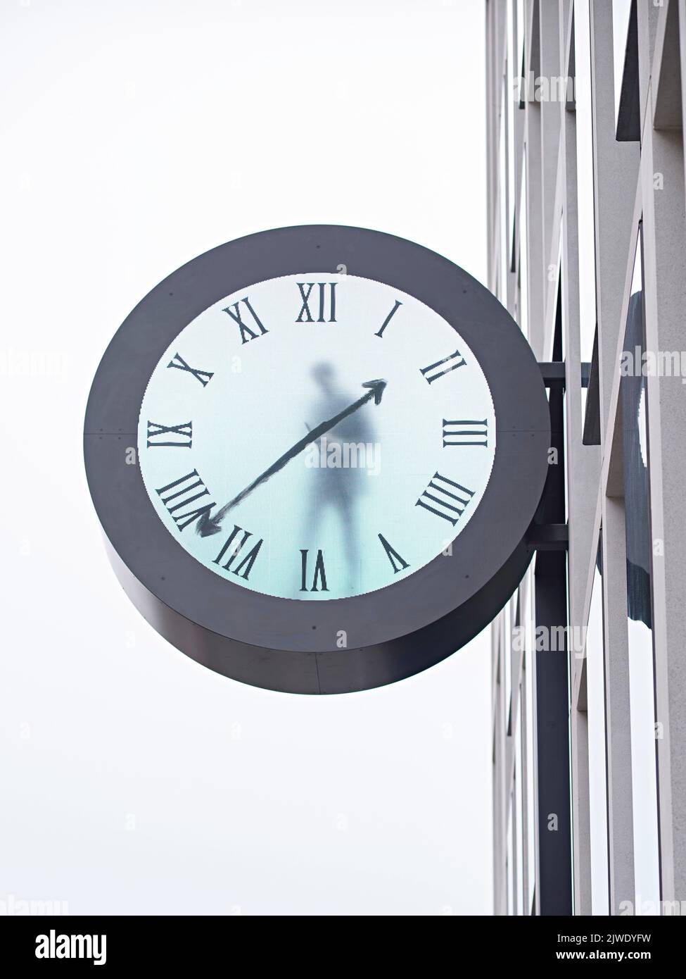 Oversized facade clock with figure painting time. 50 Eastbourne Terrace ...