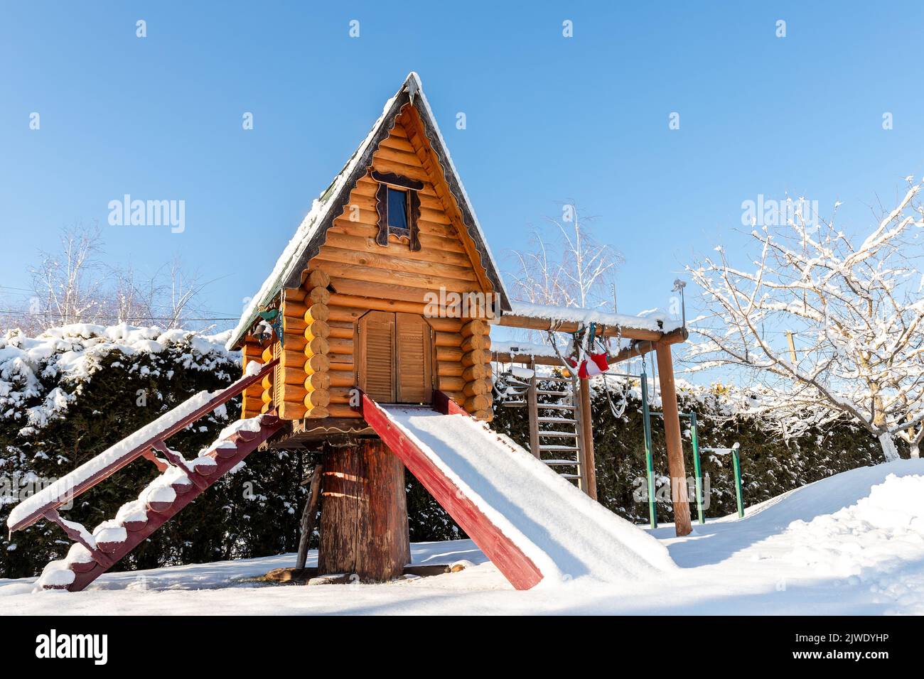 Small wood log playhouse teehouse hut snowcapped stairs ladder wooden ...