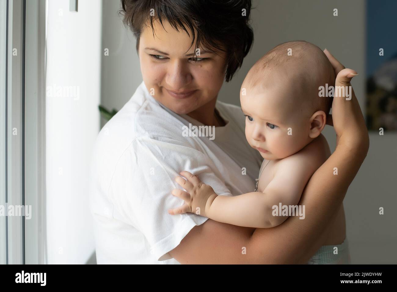 picture of happy mother with baby in hands Stock Photo - Alamy