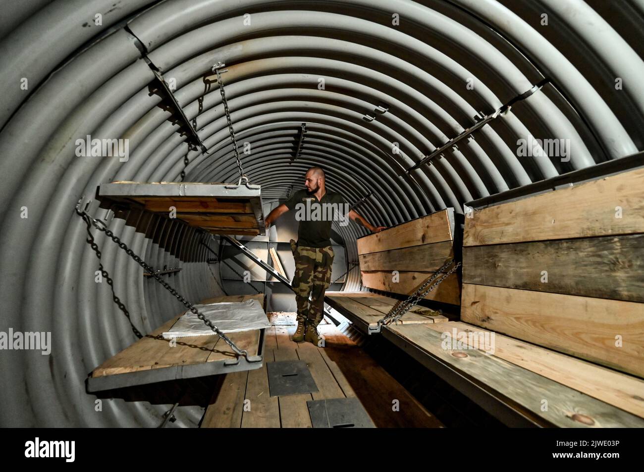 ZAPORIZHZHIA REGION, UKRAINE - SEPTEMBER 02, 2022 - A serviceman shows ...