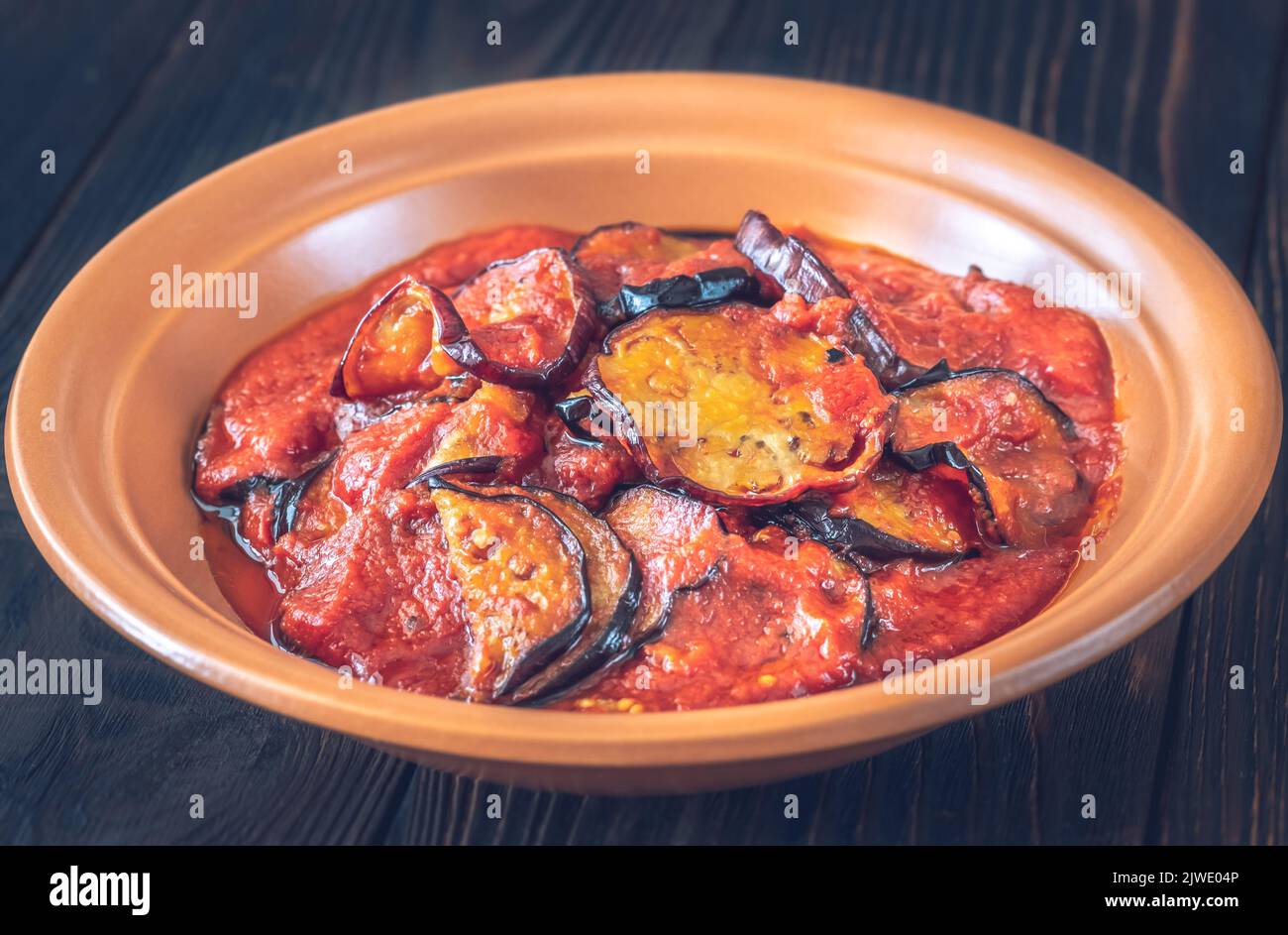 Fried slices of eggplant with tomato sauce Stock Photo - Alamy