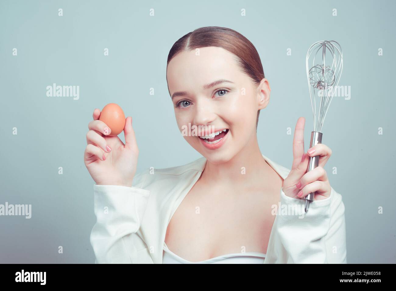 Chef girl, school of chefs in white background, balloon whisk and aggs ...