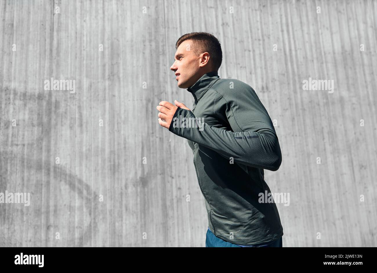 Man running up wall hi-res stock photography and images - Alamy