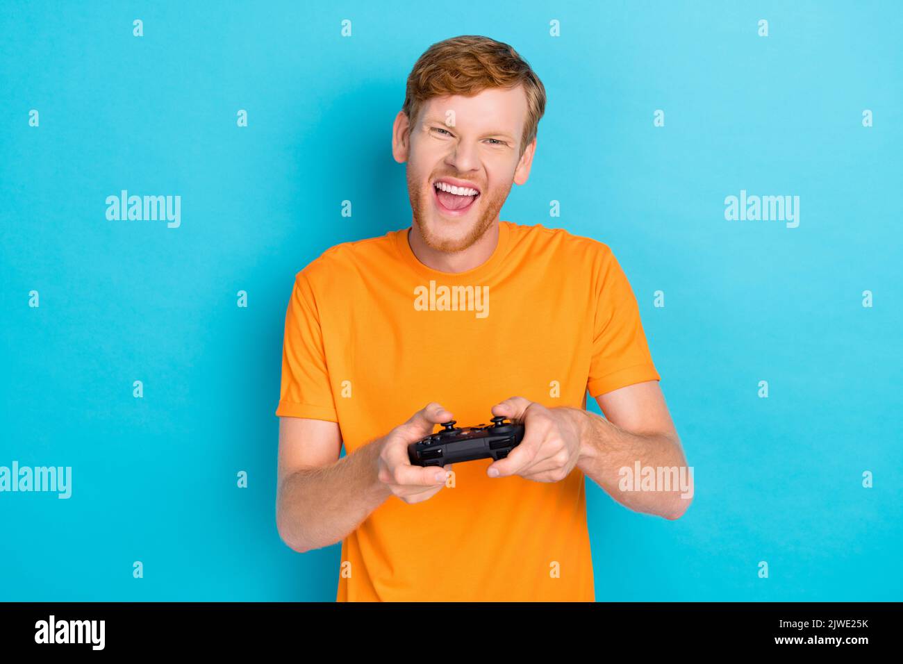 Photo of hooray ginger hair guy playstation wear orange t-shirt ...