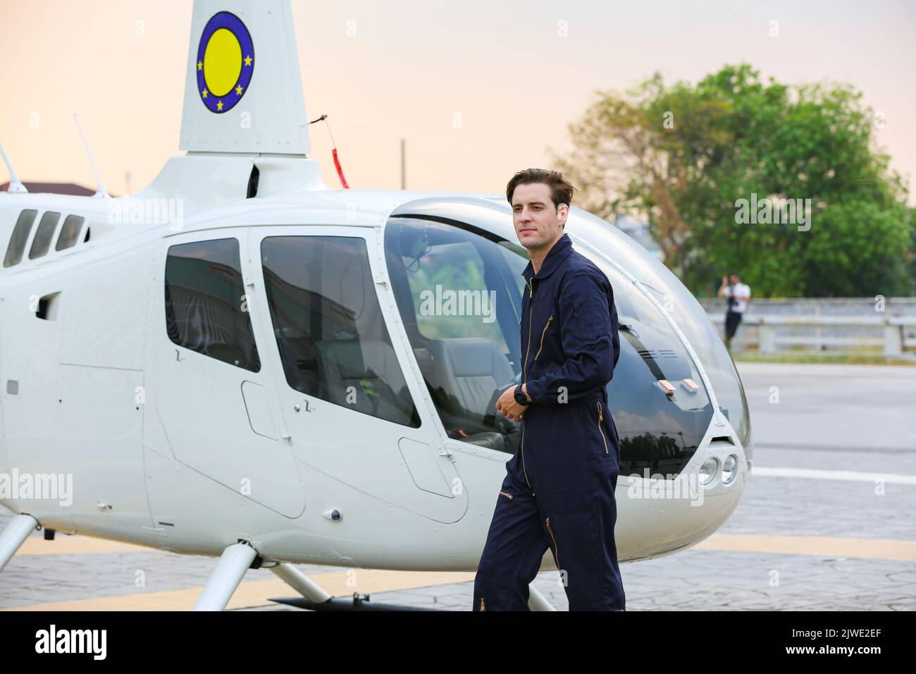 Mechanic in uniform are checking helicopter Stock Photo - Alamy