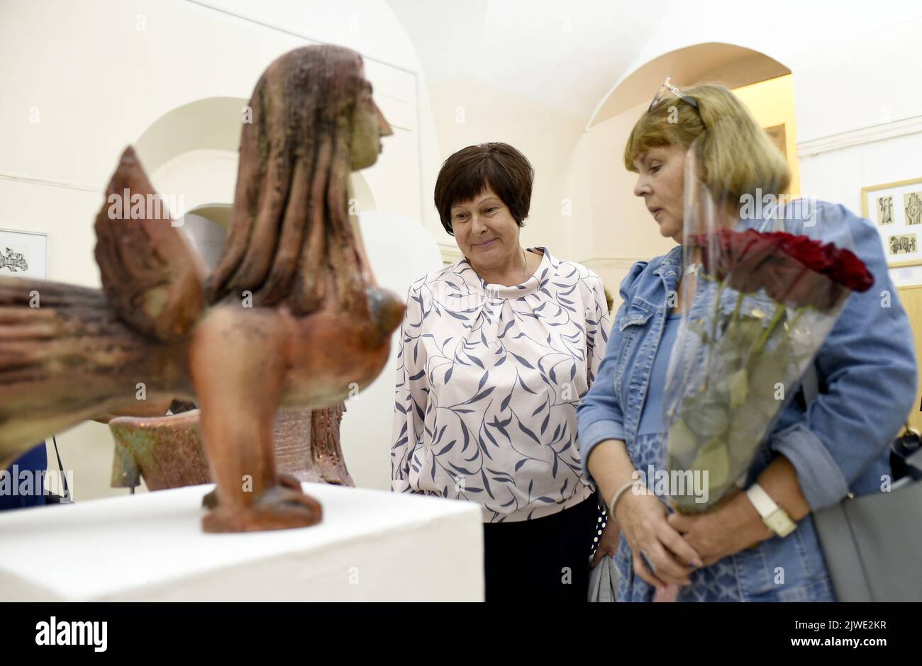 KYIV, UKRAINE - SEPTEMBER 02, 2022 - Visitors look at the art pieces ...