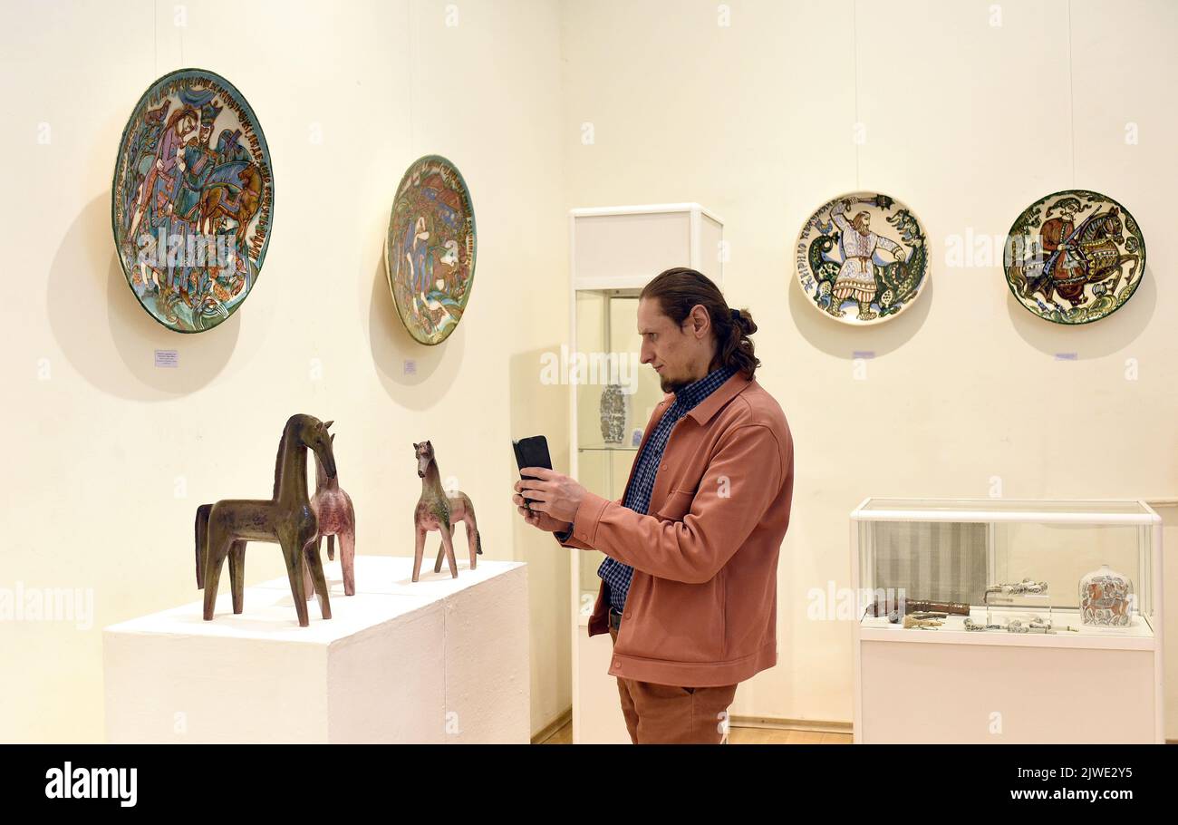 KYIV, UKRAINE - SEPTEMBER 02, 2022 - A visitor takes a photo of horse ...