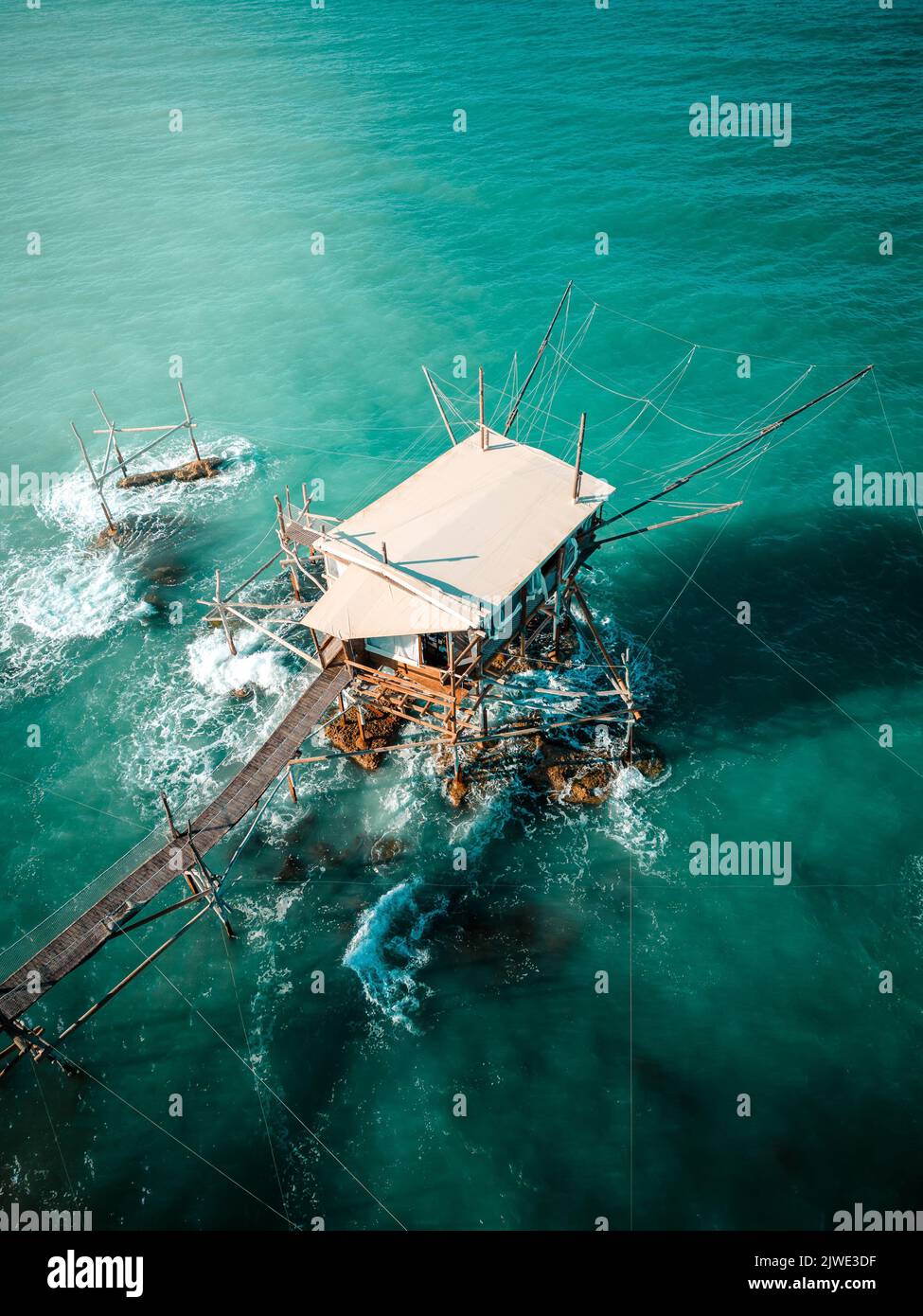 An aerial view of traditional fishing bagang over turquoise sea Stock ...