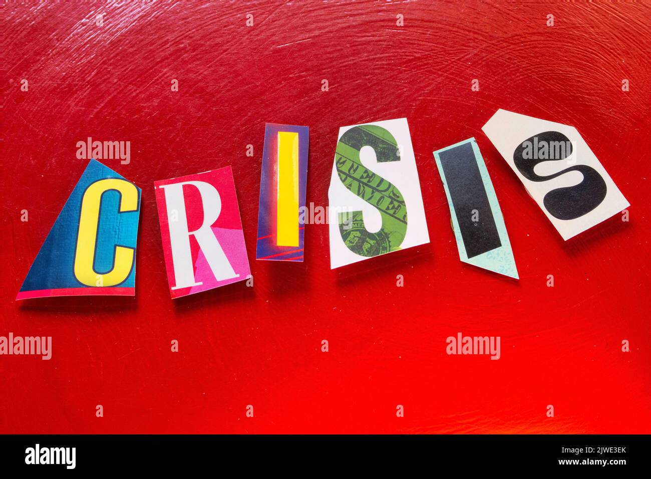The Word "Crisis" using cut-out paper letters in the ransom note effect ...
