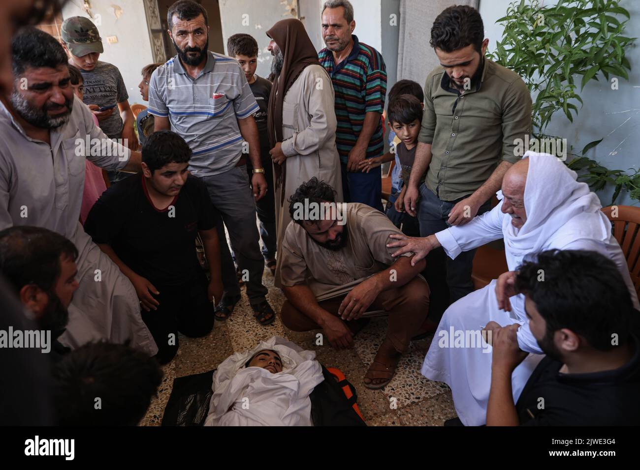 Maar Belit, Syria. 05th Sep, 2022. Syrians mourn during the burial of ...