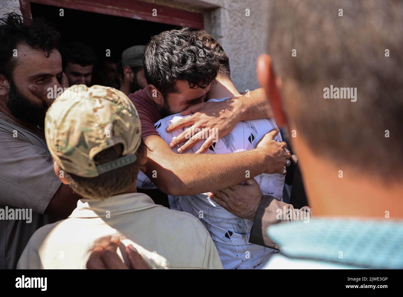 Maar Belit, Syria. 05th Sep, 2022. Syrians mourn during the burial of ...