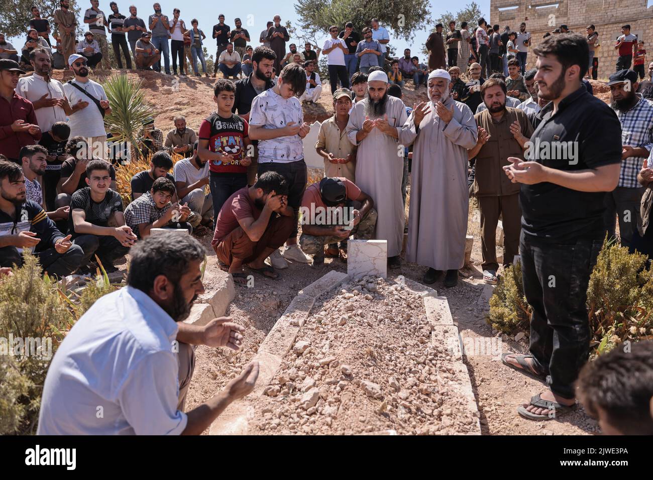 Maar Belit, Syria. 05th Sep, 2022. Syrians bury the body of Fares al ...