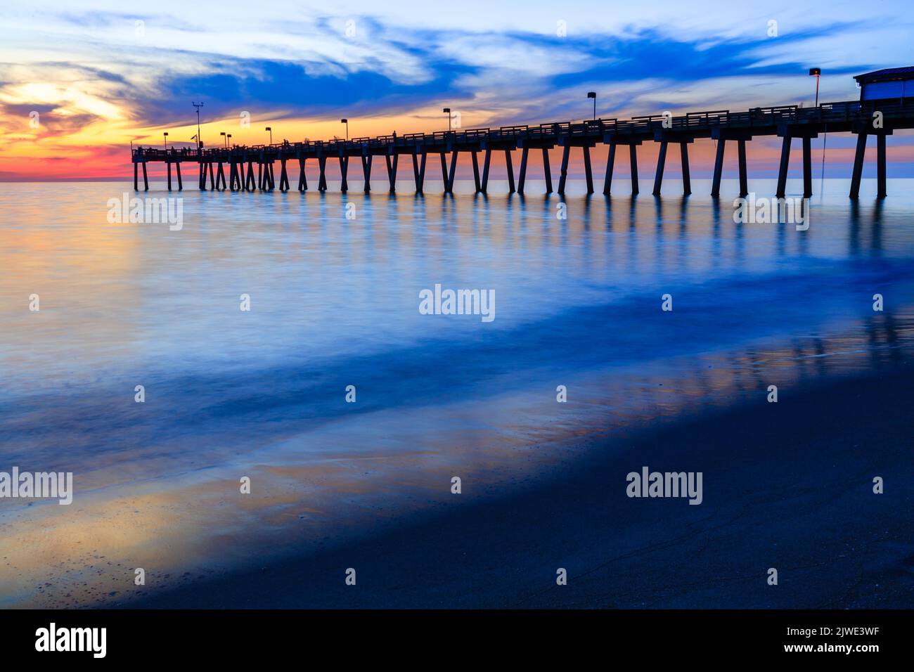 Venice pier, Florida, at sunset with intentionally blurry waves to show ...