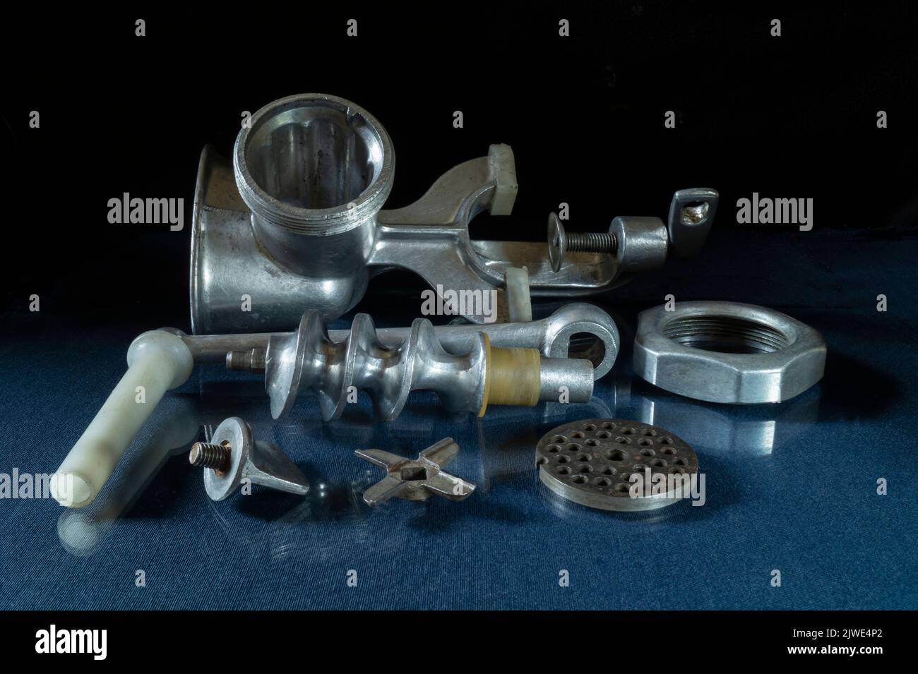 Kitchen equipment on a black background. Hand tool for meat processing ...