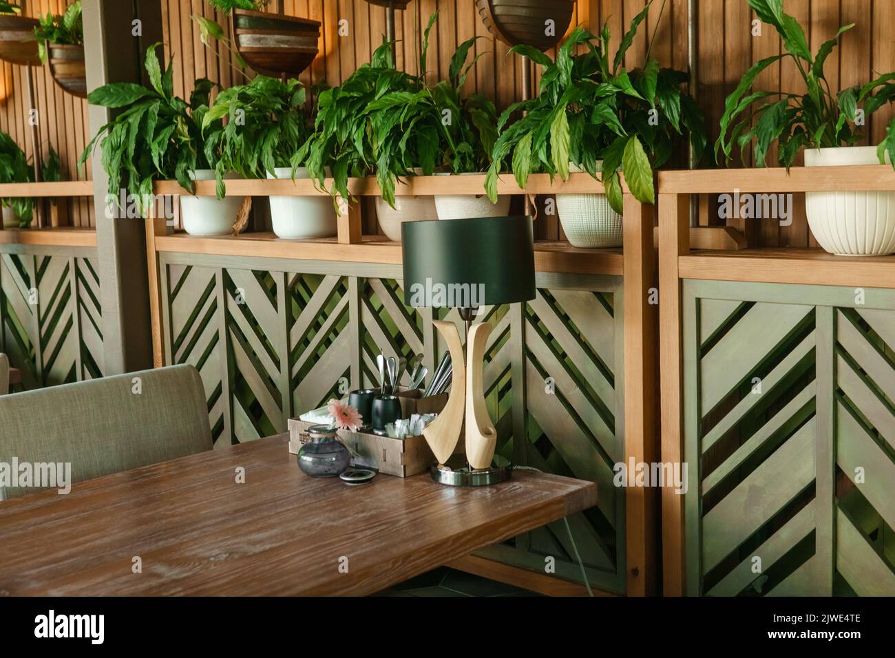 Cafe interior with elements of biophilic design. The concept of ...