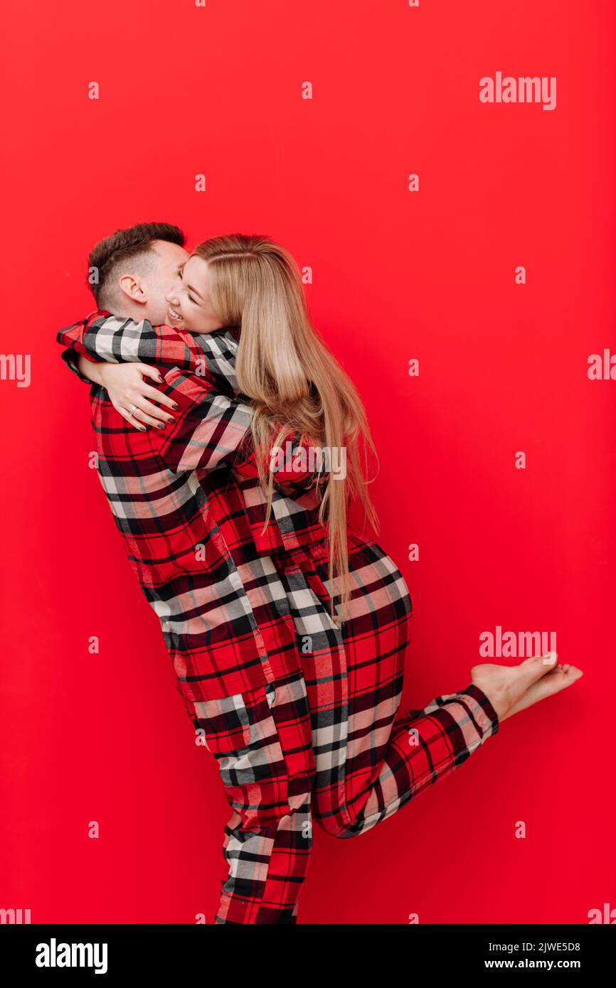 Happy Saint Valentine's Day. Young couple in the same pyjamas is ...