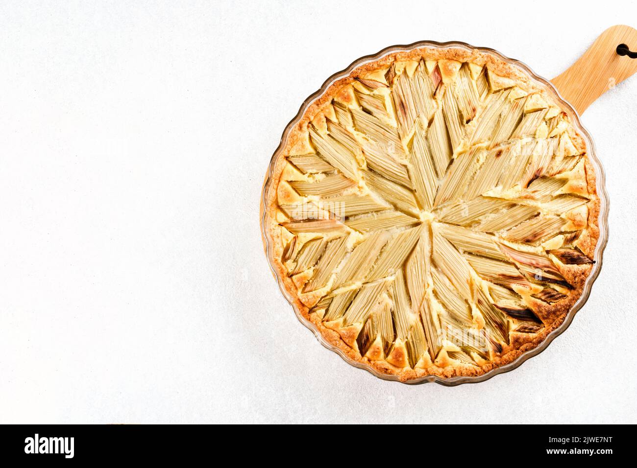 Top view on homemade rhubarb geometric pie with almond frangipane cream ...
