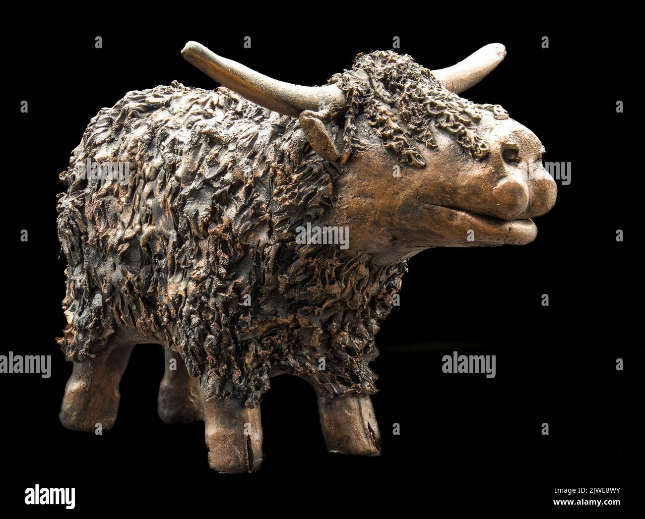 detailed close-up of a hand-made clay scottish red highland cow model ...