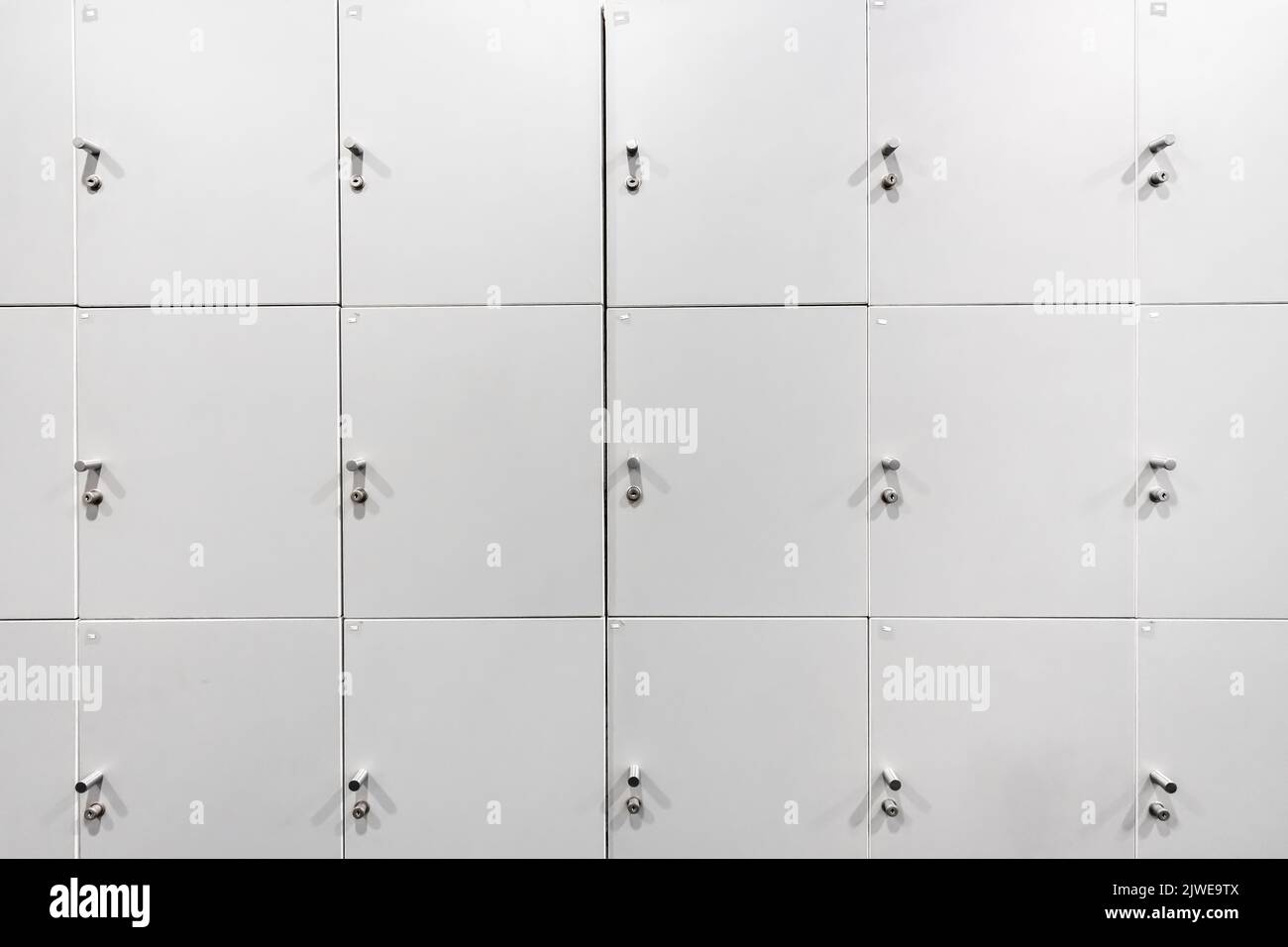 Large gray locker with each locker closed located beside corridors ...