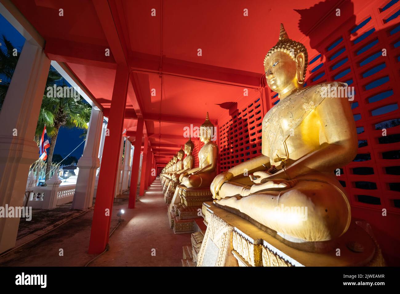 Several golden statues of Buddha statues in meditation posture are ...