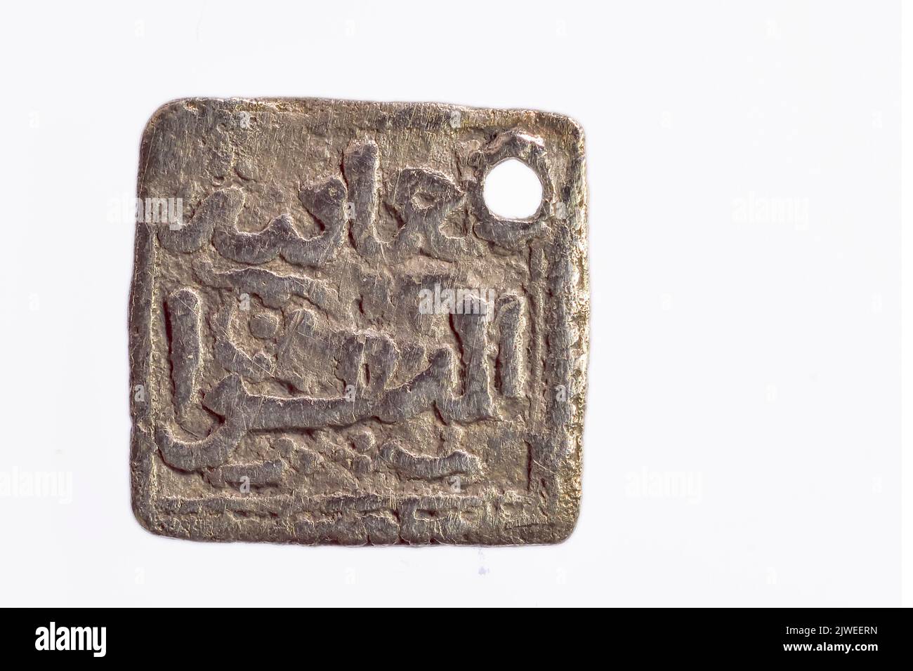 Nasrid silver dirham. Square silver coin from the kingdom of Granada ...