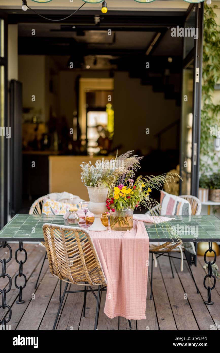 Dining place on terrace at backyard Stock Photo - Alamy